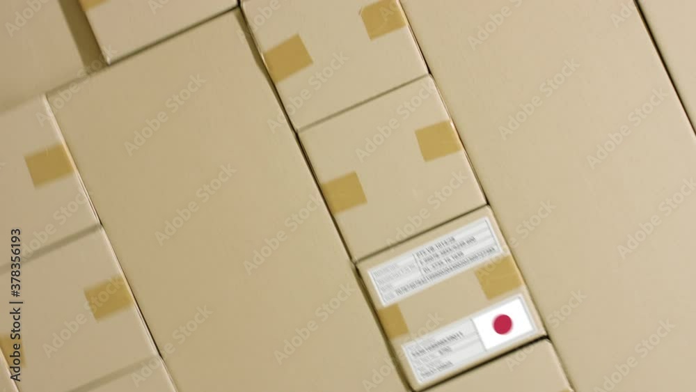 Parcel with MADE IN JAPAN text and flag, production and transportation ...