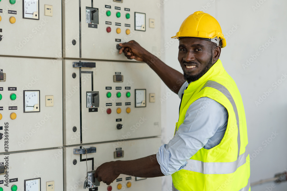 African electrical worker open power circuit breaker voltage switch at ...