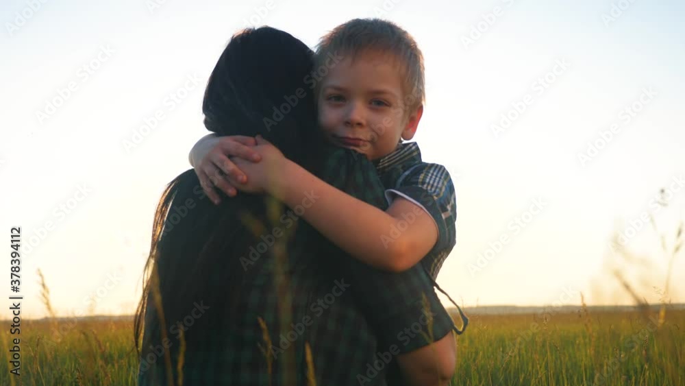 son hugs mom. concept happy family teamwork. boy kid hugs beloved ...