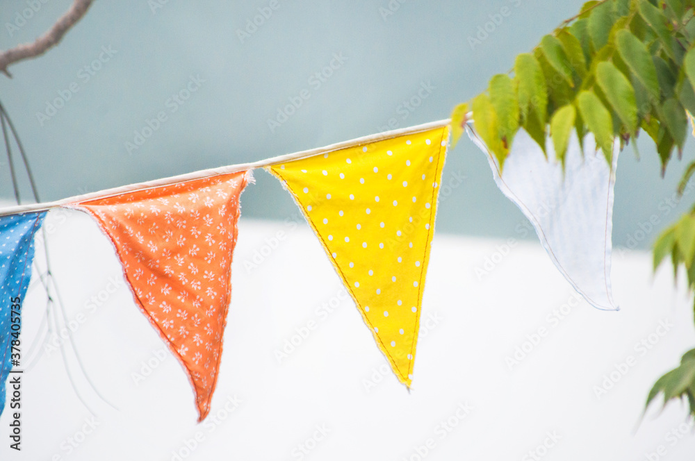 Banderas de colores en forma triangular. Stock Photo | Adobe Stock