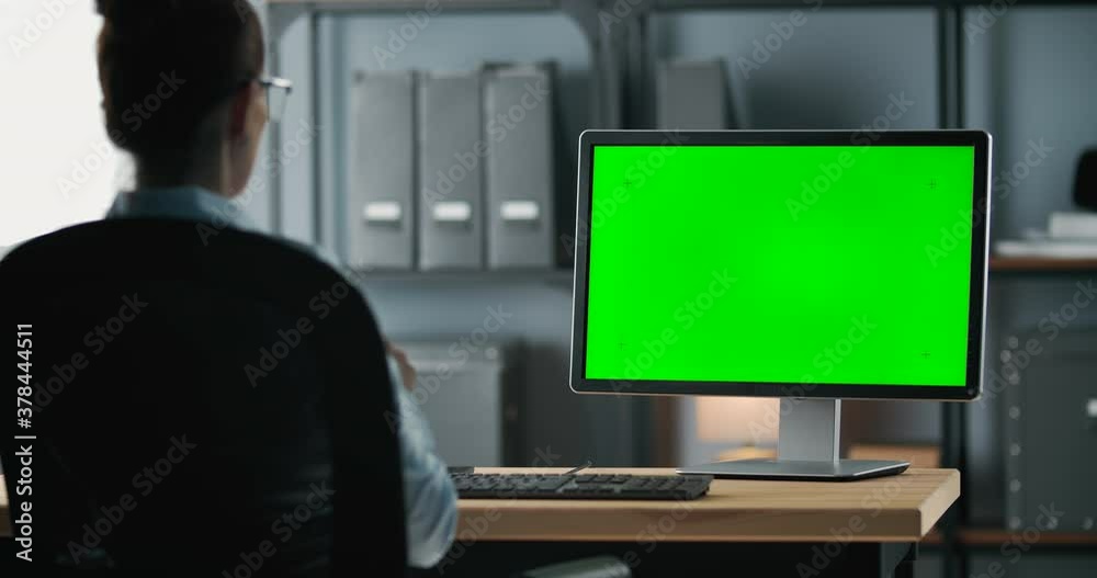 Back view of woman sitting comfortably on chair while relaxing after ...