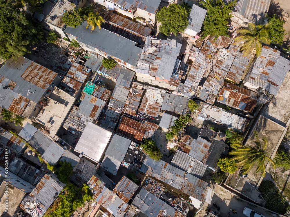 Aerial top view of rooftops of poor people in slums. Hoyo, Friusa ...