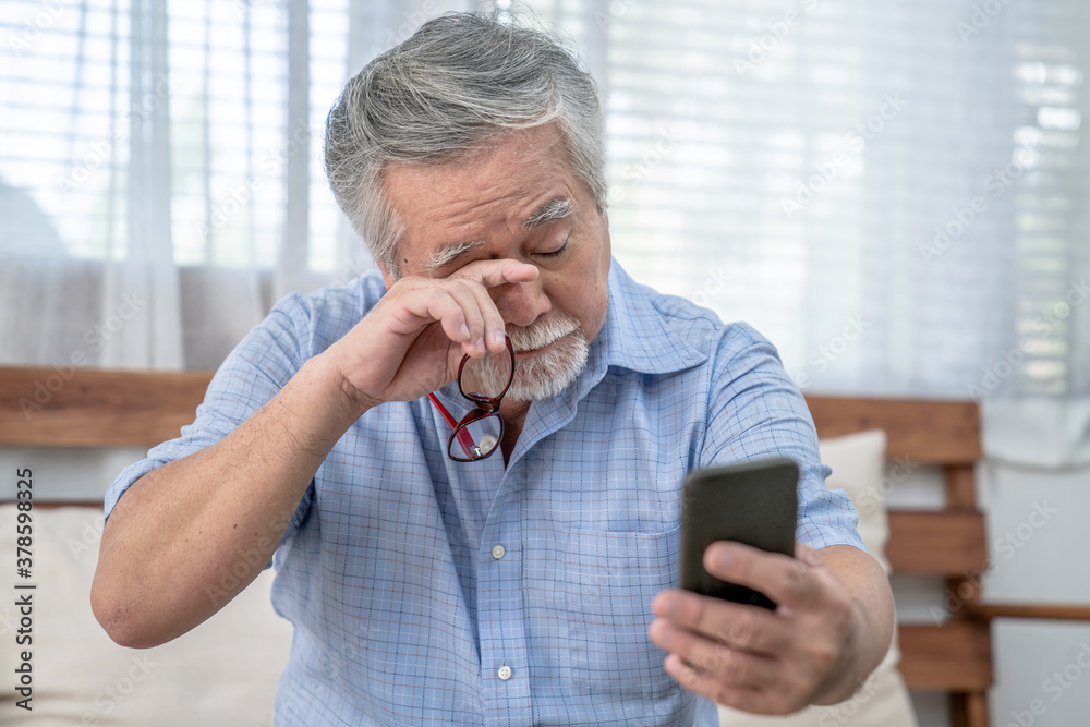 Asian elderly man who has eye pain and poor vision, Long sighted ...