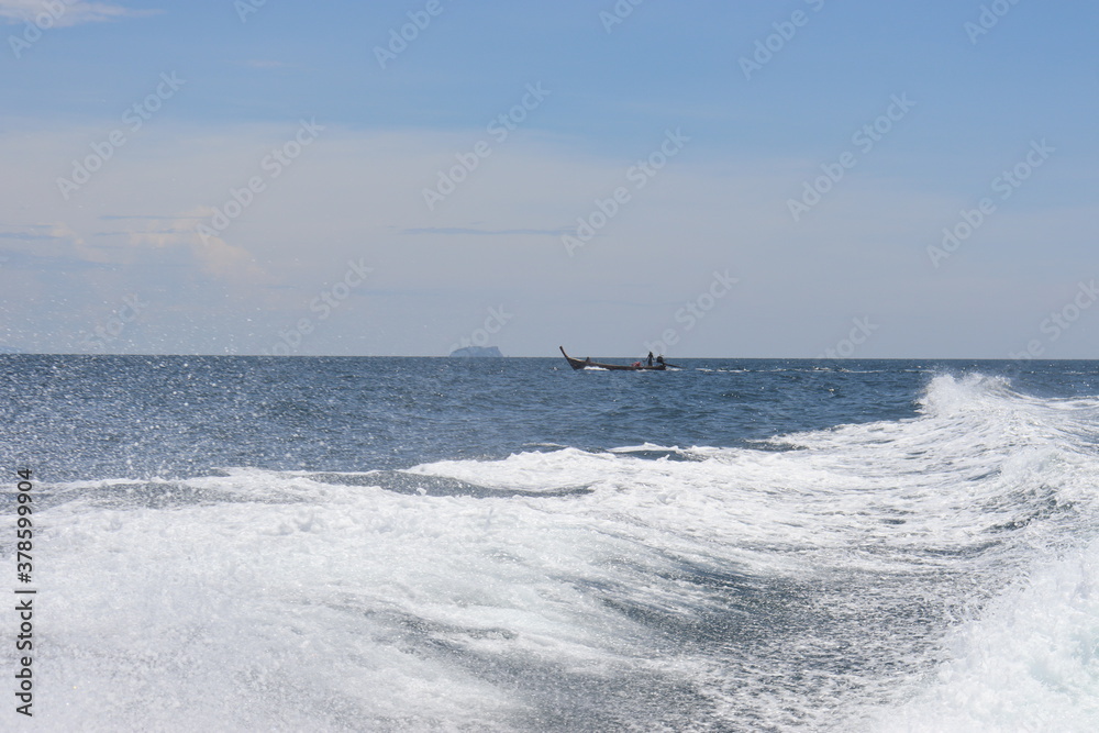 nature of tropical islands in the ocean,waves and splashes, speedboat ...