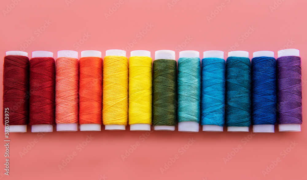 Spools of thread on the colors of the rainbow Stock Photo | Adobe Stock