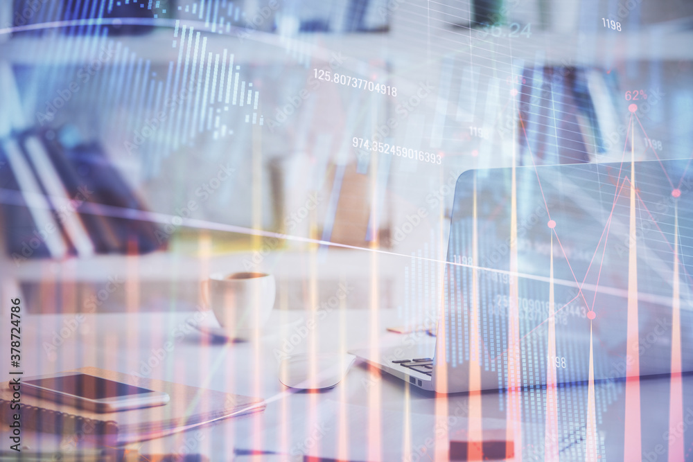 Stock market graph on background with desk and personal computer ...