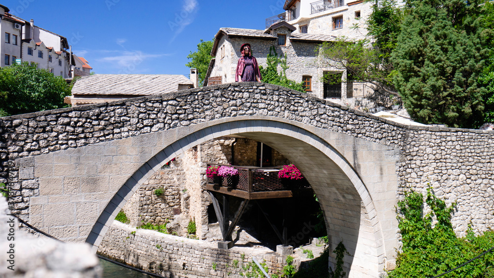 Attractive fashion woman on the Kriva Cuprija (Sloping Bridge), the ...
