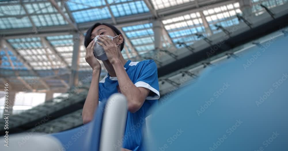 Professional asian soccer or football player wearing mask. Team sports ...