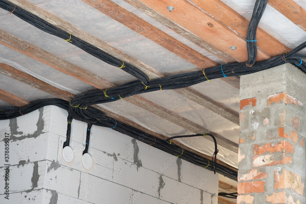 Cable laying ceiling. Electrical wires on wall. Wiring replacement ...