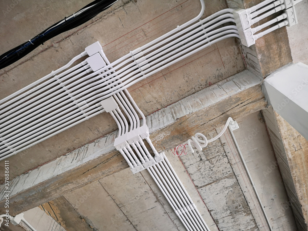Installation of electrical wiring on the ceiling.Electrical cable ...