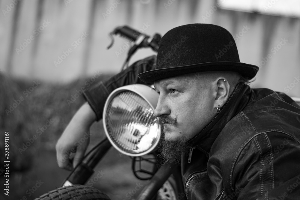 black and white photo of a biker. beautiful man's mustache. man in a ...