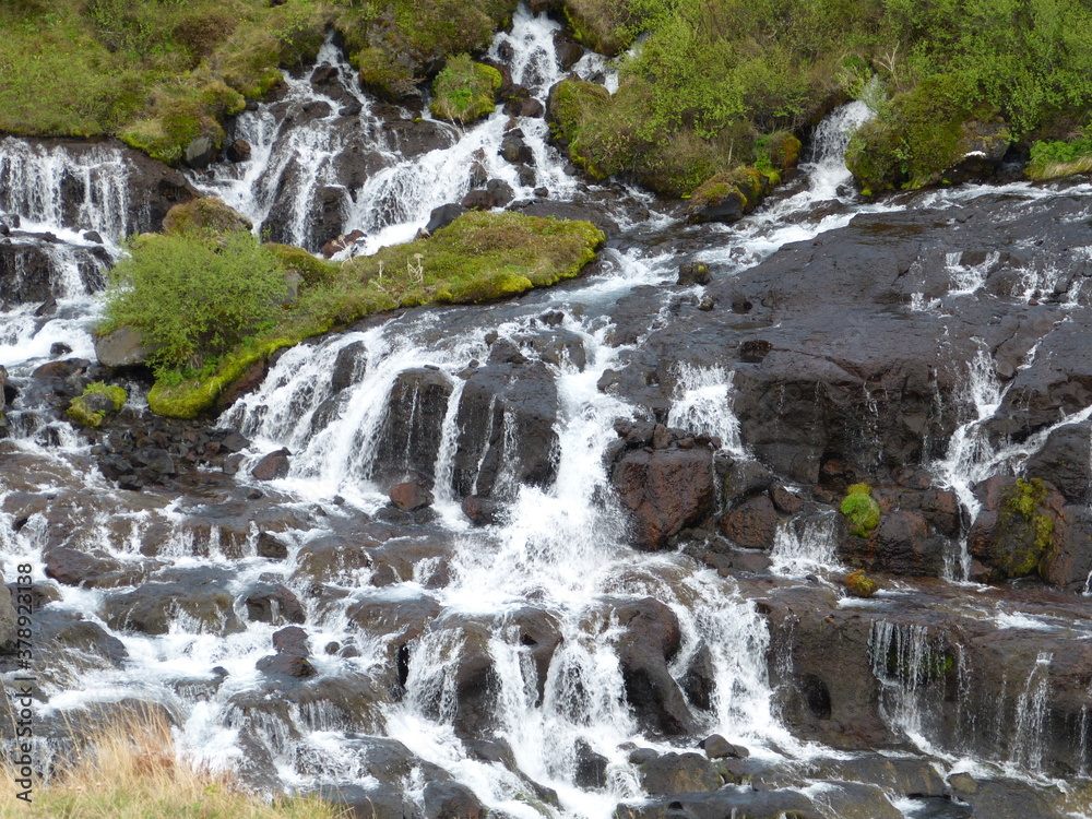 Waterfall Hraunfossar in Iceland. Stunning white uncountable falls run ...