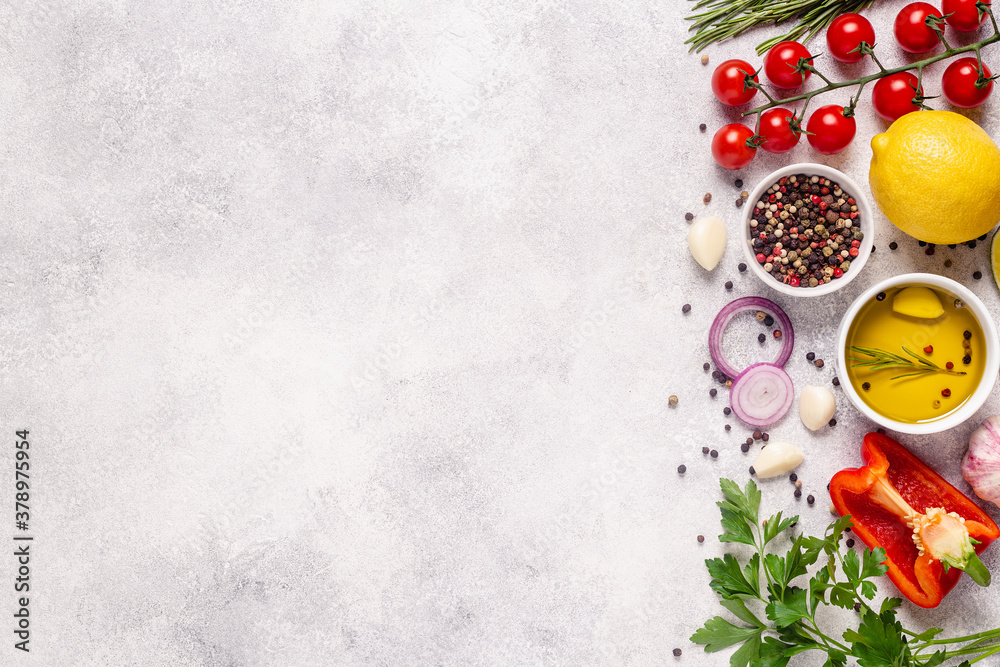 Herbs and condiments on light stone background. Stock Photo | Adobe Stock