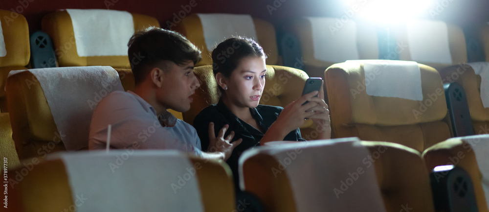 Do not use a mobile phone in the cinema. Group of diversity people ...