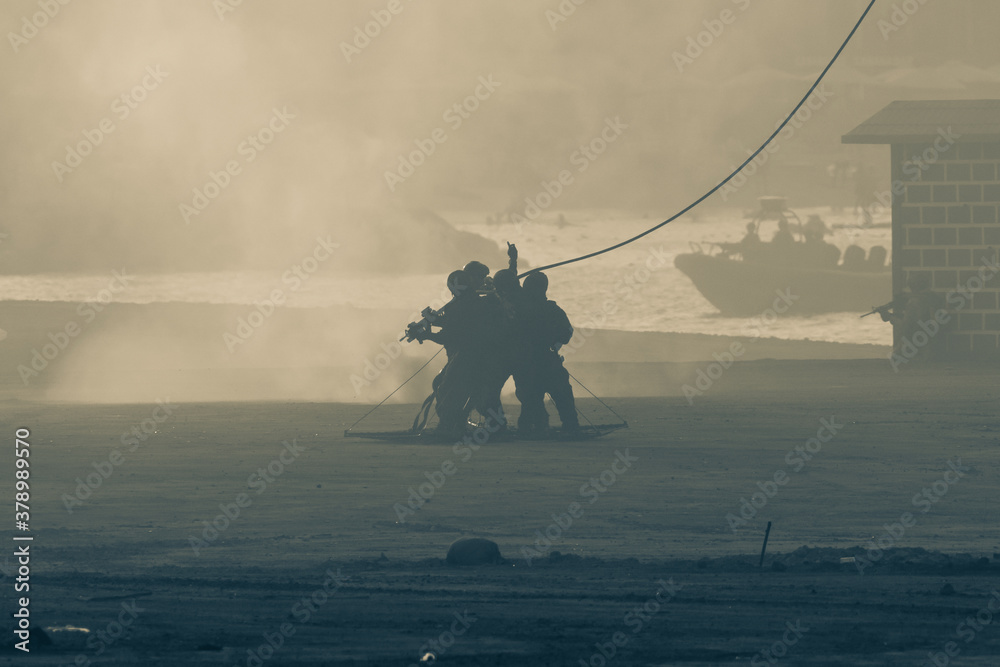 Military chopper takes off in combat and war flying into the smoke and ...