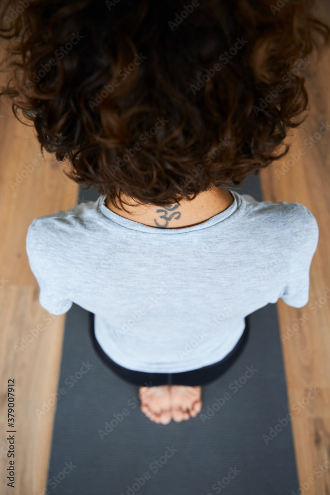 Woman practicing yoga in diamond pose, Vajrasana, Thunderbolt Pose in ...