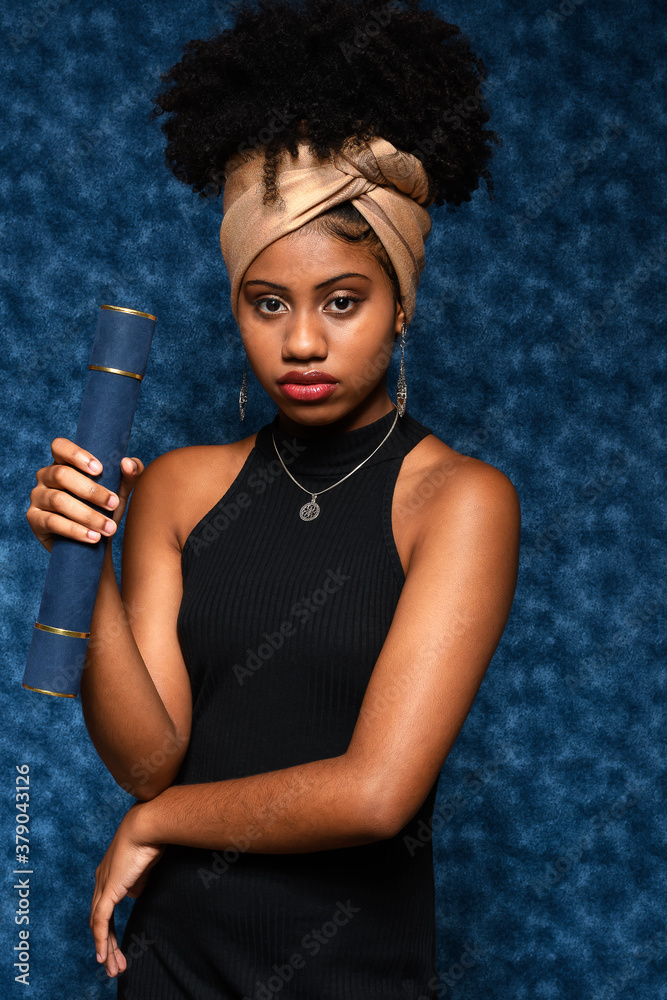 afro brazilian student holds the graduation diploma, wear a turban in ...