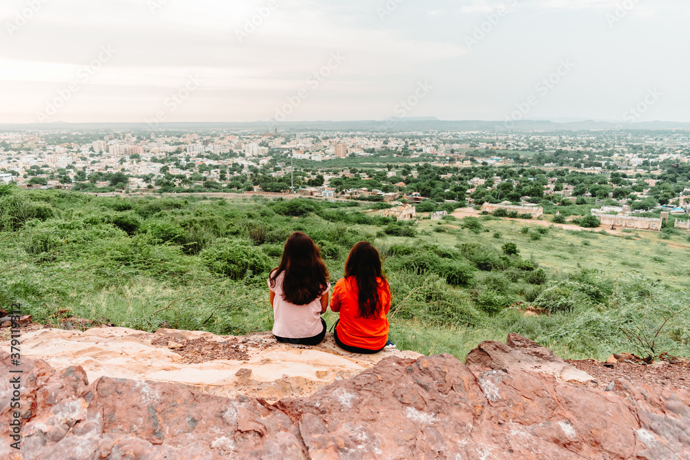 two friends enjoying view of the Bhuj city from above the Bhujiyo hill ...