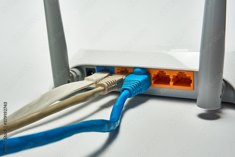 Connecting to a router, network cables connected to a router. Stock ...
