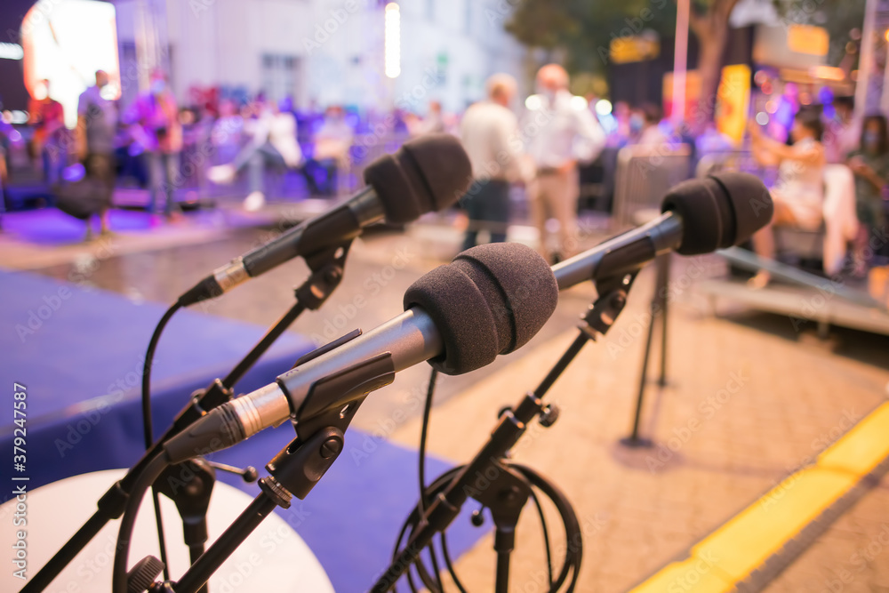 microphones ready for speakers at an event Stock Photo | Adobe Stock