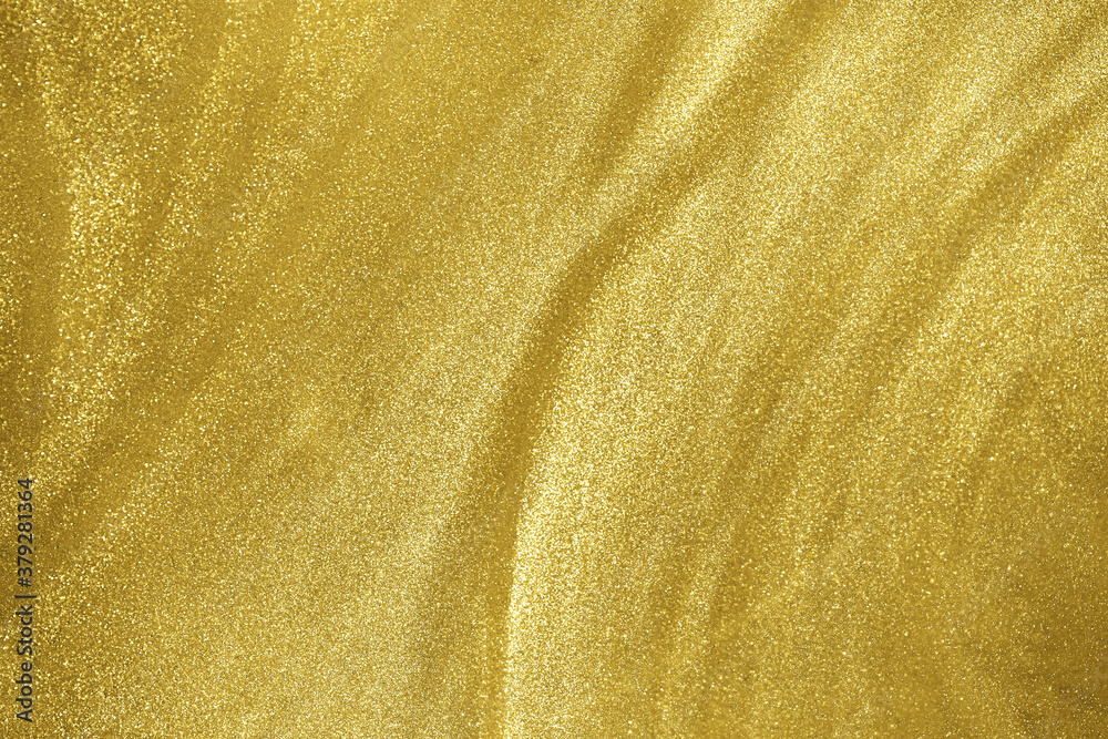 de-focused. Abstract elegant, gold glitter particles flow with shallow ...