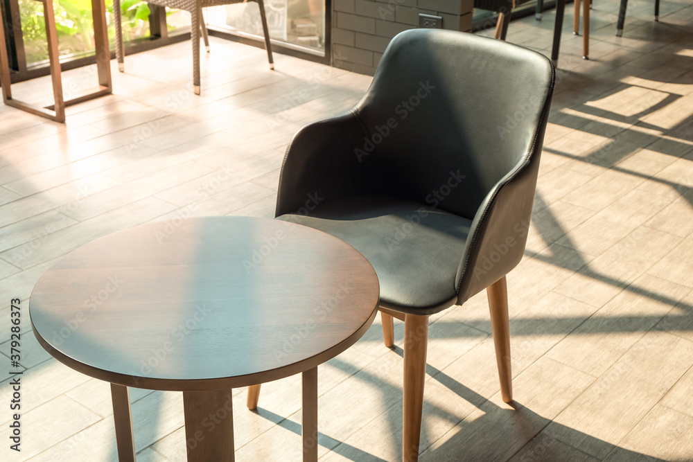The cozy interior design of the cafe with table and chair with sunlight ...