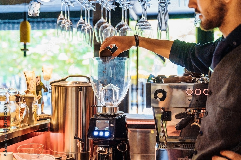Professional coffee grinder in a good restaurant. Close-up of a holder ...