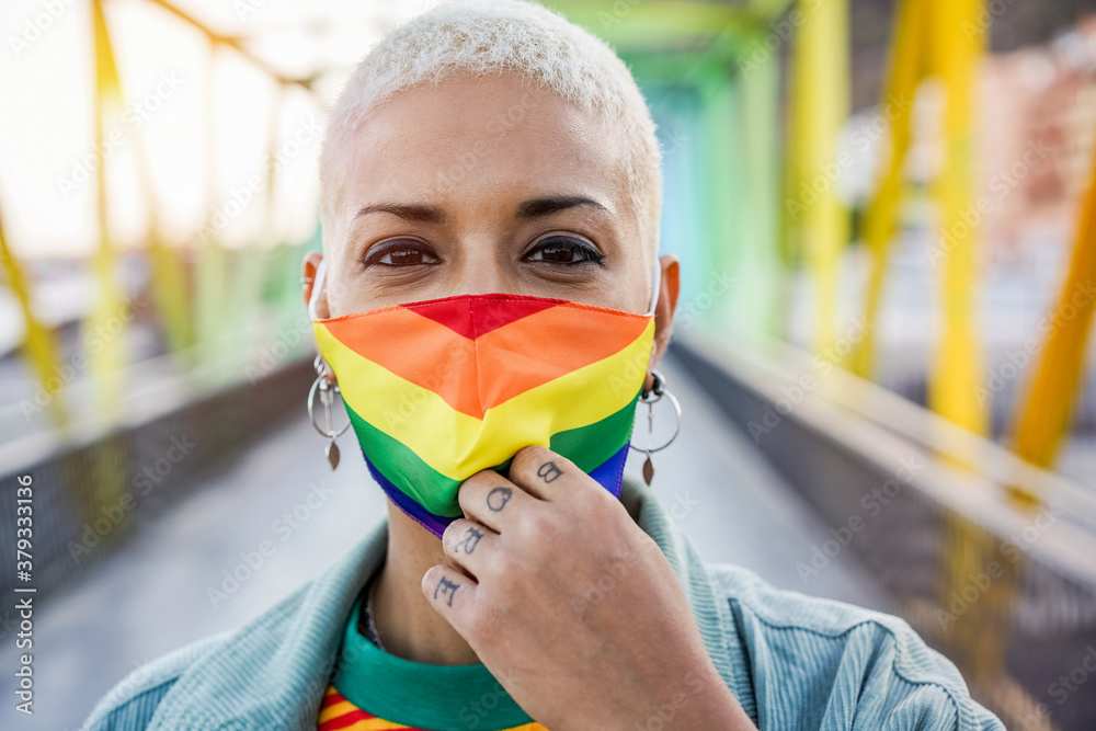 Young woman wearing gay pride mask - Lgbt rights, diversity, tolerance ...
