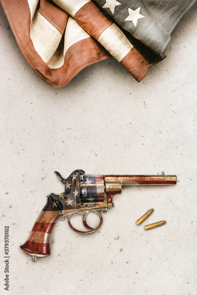 Revolver gun with bullets on a concrete background with vintage ...