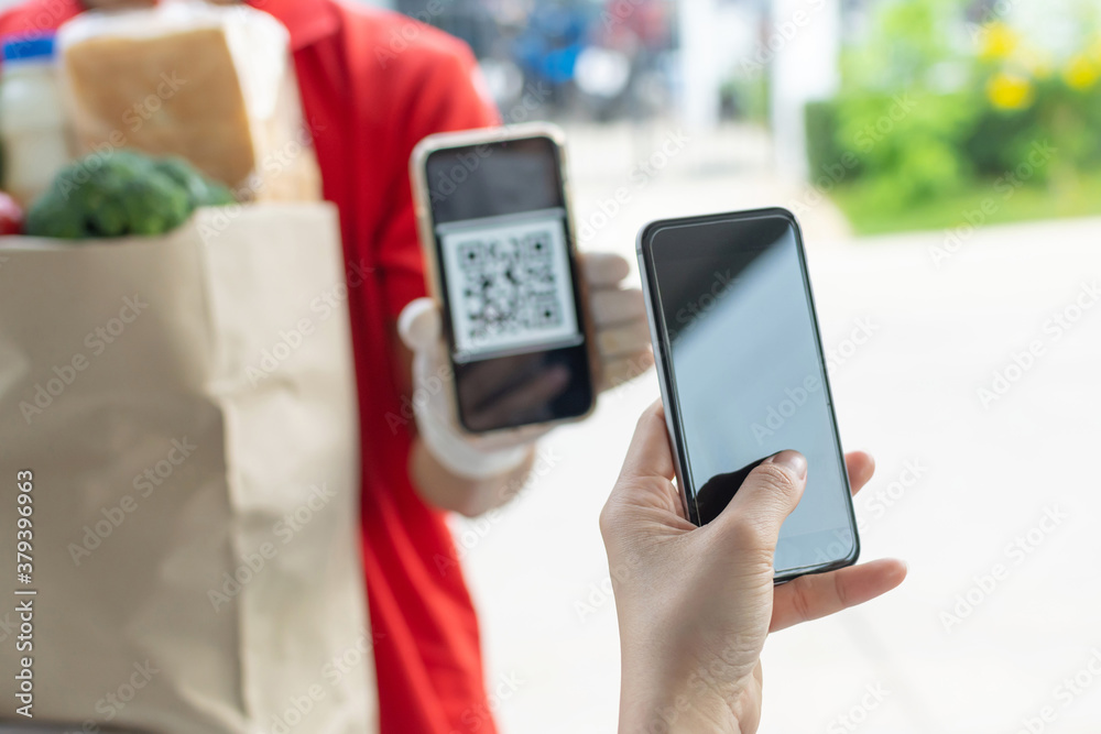 customer hand using digital mobile phone scan QR code paying for buying ...