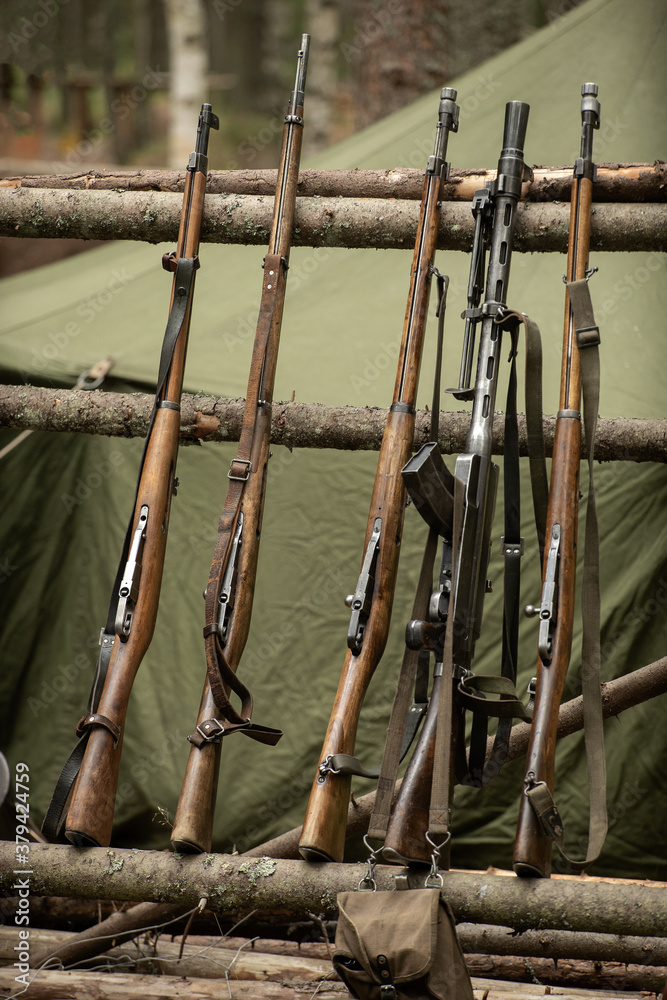 World war II weapons in a forest camp. Rifles and submachine guns Stock ...