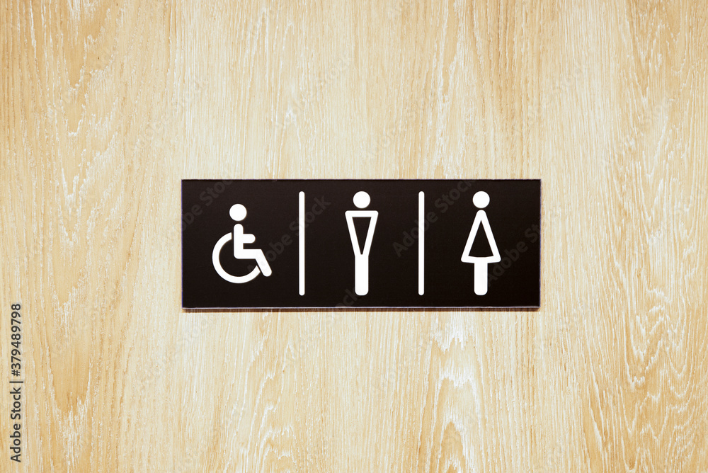 Toilet sign and direction on wood wall Stock Photo | Adobe Stock