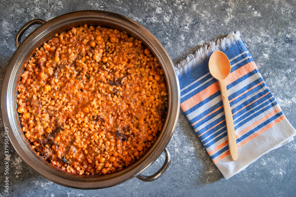 Turkish traditional food keskek in steel pot, made from wheat grains ...