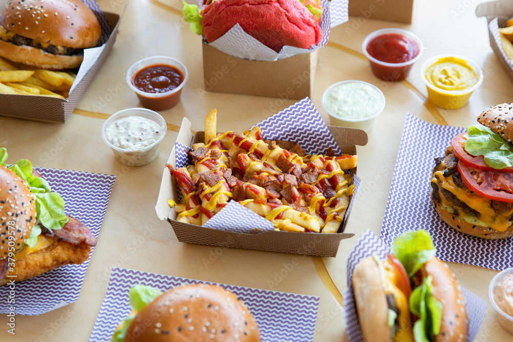 Burger restaurant layout with cheese & bacon loaded fries placed on ...
