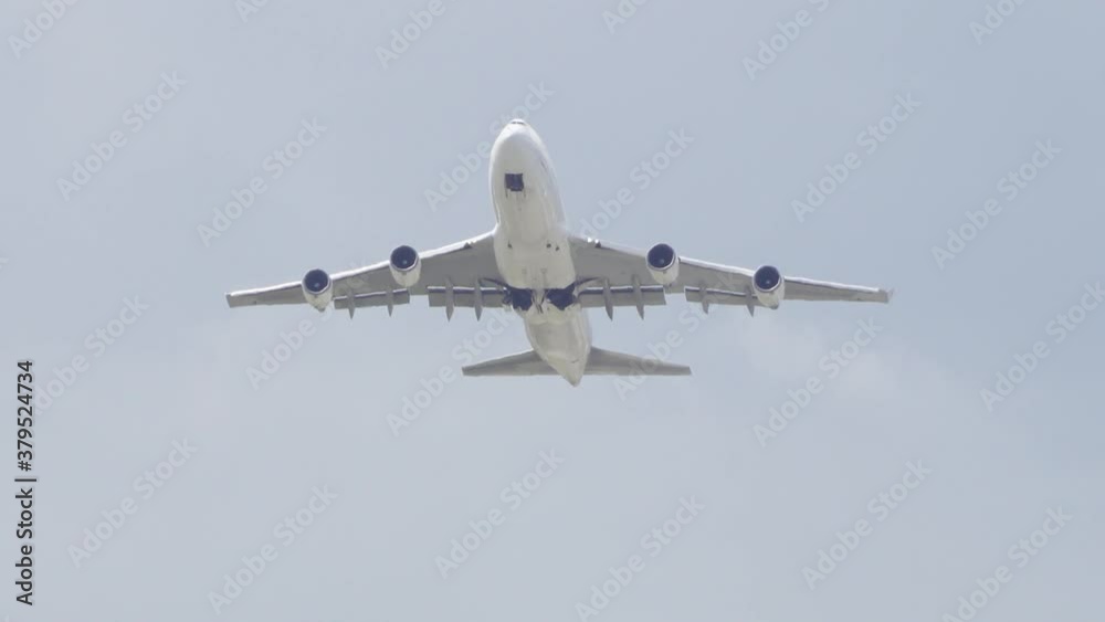Stockvideo White four-engine widebody jumbo airplane take off from ...