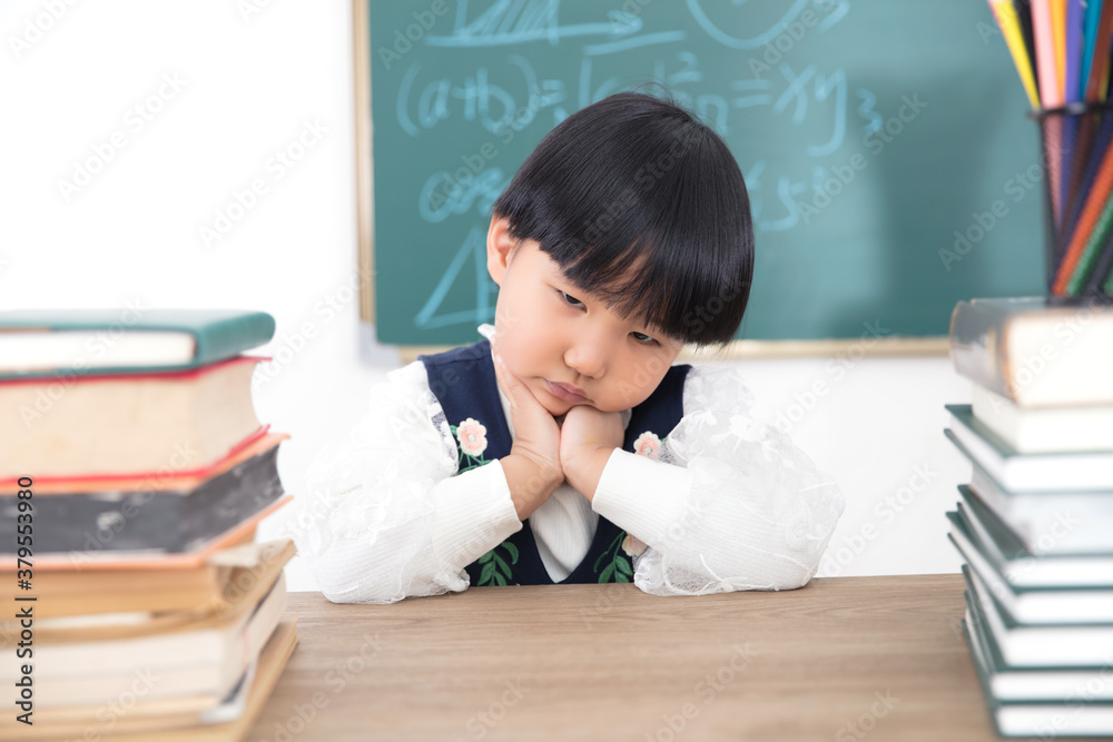 Asian little girl who doesn't want to study Stock Photo | Adobe Stock