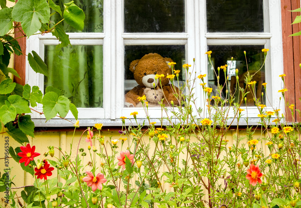 Going on a bear hunt concept. Large stuffed toy teddy bear with small ...