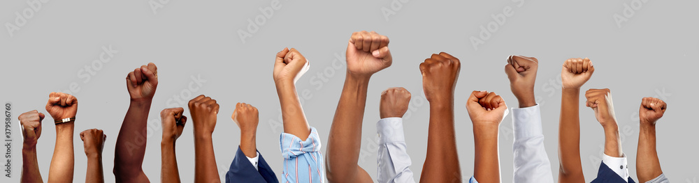 civil rights, equality and power concept - african american male hands ...