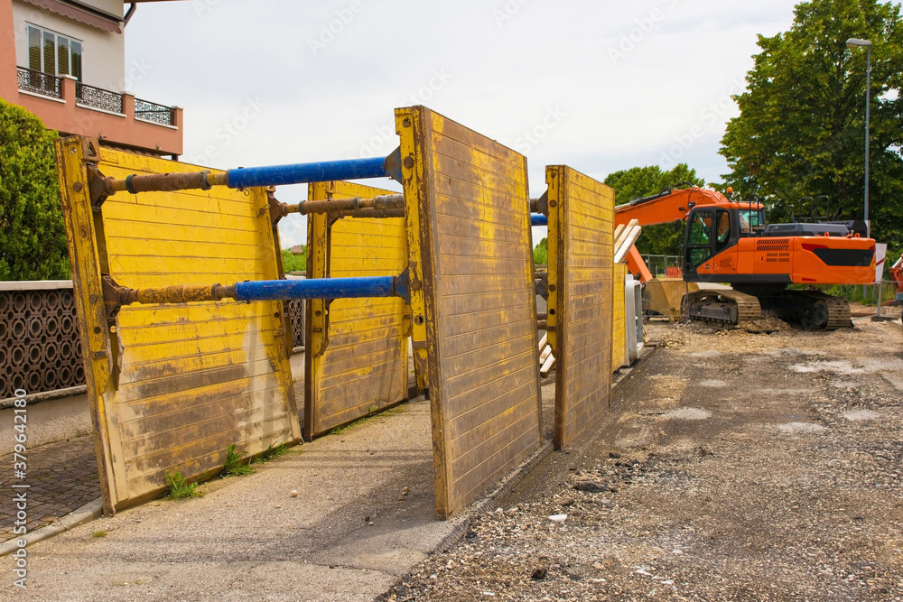Trench boxes, also called trench shields or trench sheets, at the site ...