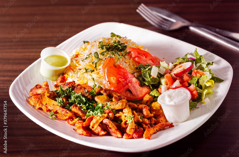 Mediterranean Chicken Shawarma Entree with Rice and Salad Stock Photo ...