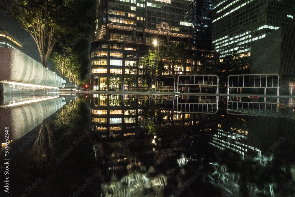 Tokyo Station Marunouchi after the rain with a beautiful mirror surface ...