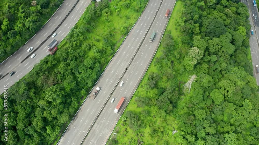 Flyby drone over three parallel roads passing through the Jungles of ...