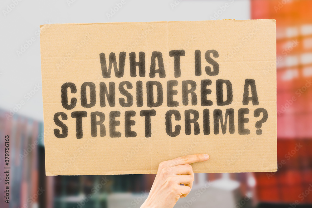 The question " What is considered a street crime? " on a banner in men ...