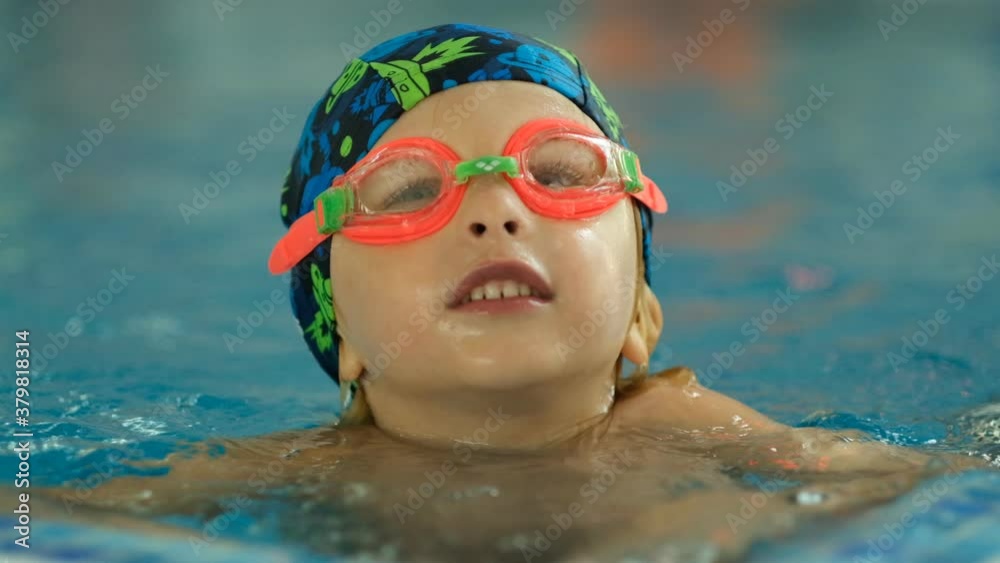 Future champion. Swimming training for the little champion. Little cute ...