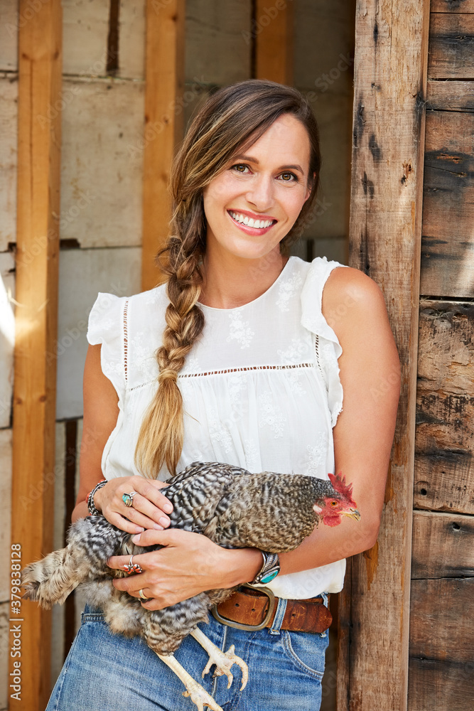 Beautiful woman holding chicken in her backyard chicken coop Stock ...