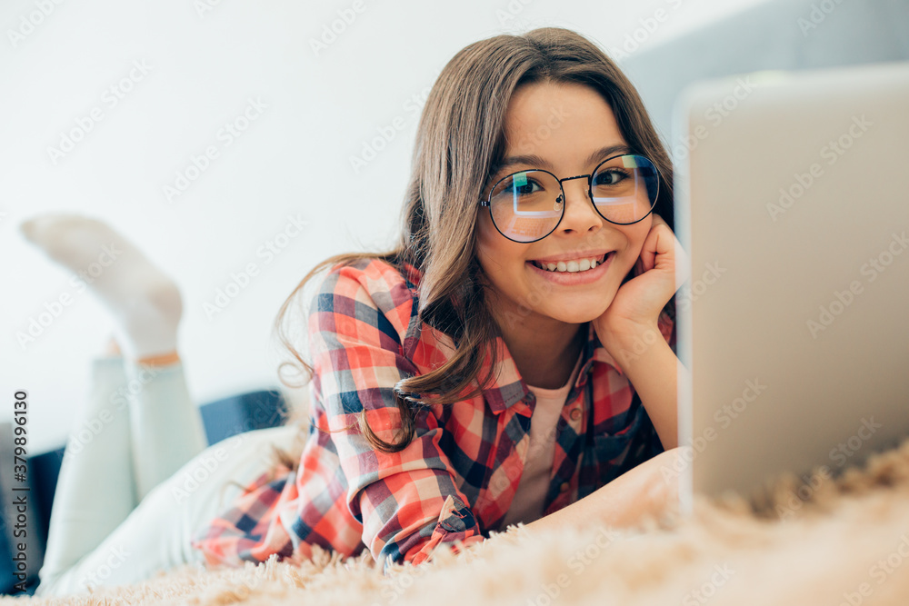 Contented girl in front of the screen of computer at home Stock Photo ...