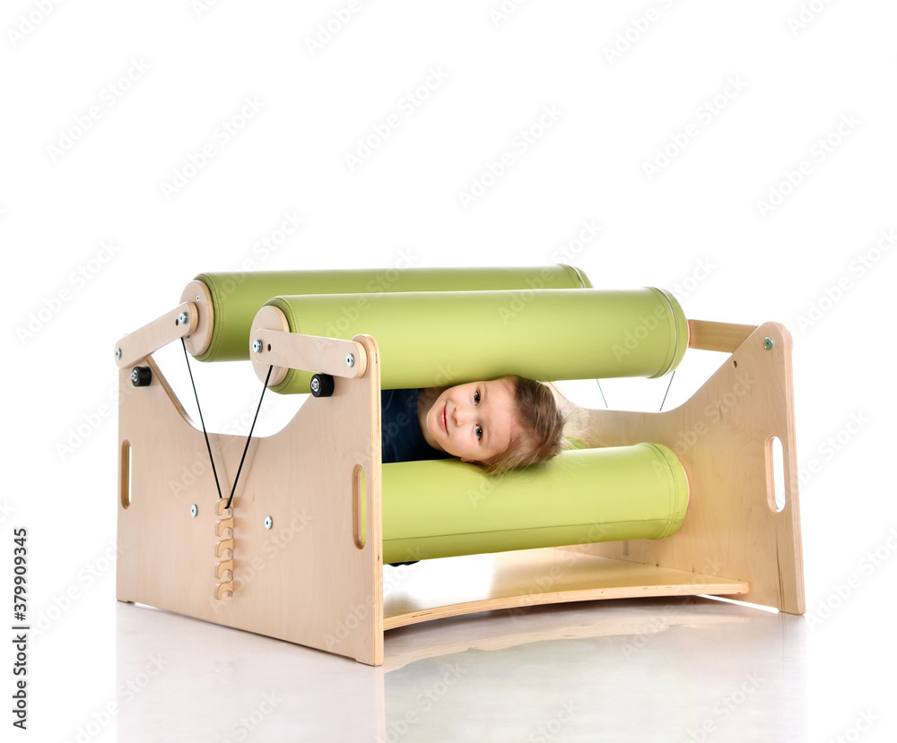 Smiling little child demonstrating usage of exercise set for persons ...