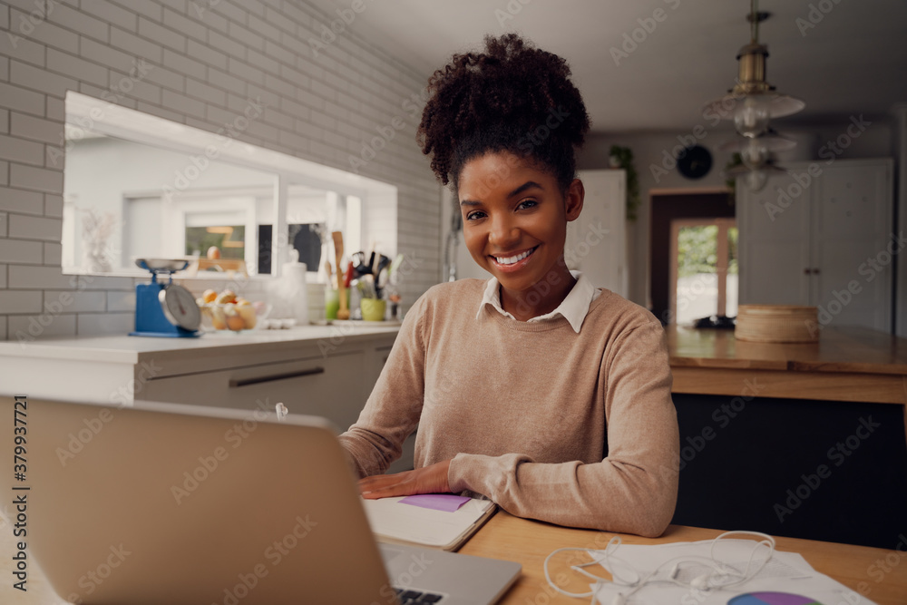 Student studying and learning online with a laptop in a desk at home ...
