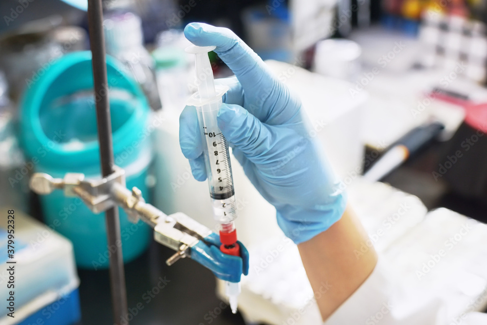 Scientist performing a test Stock Photo | Adobe Stock