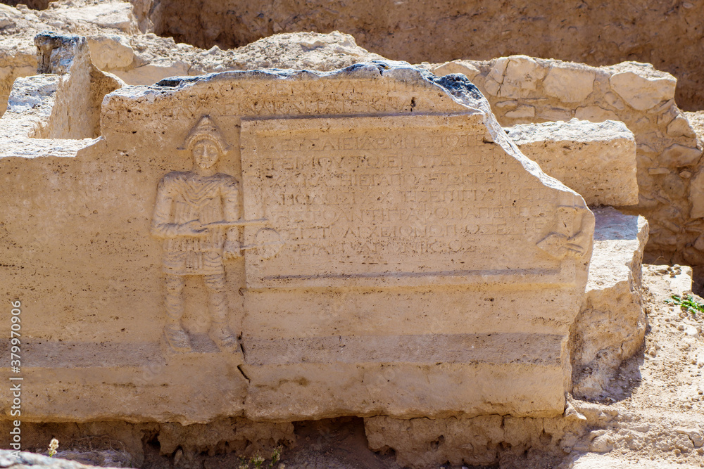 Side part of antique sarcophagus with bas-relief of god or human in ...